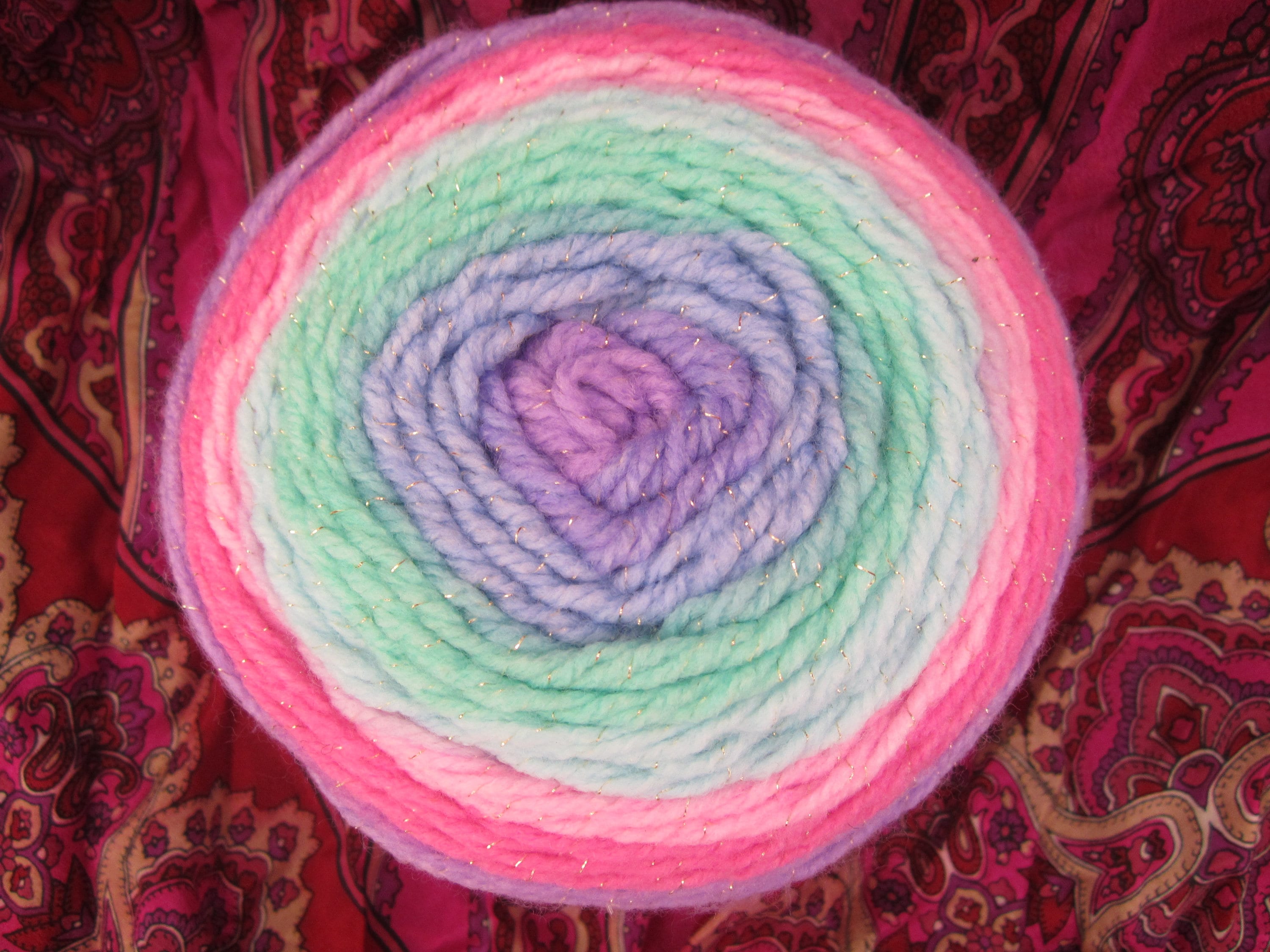 Draco Lion Brand Mandala Sparkle yarn cake