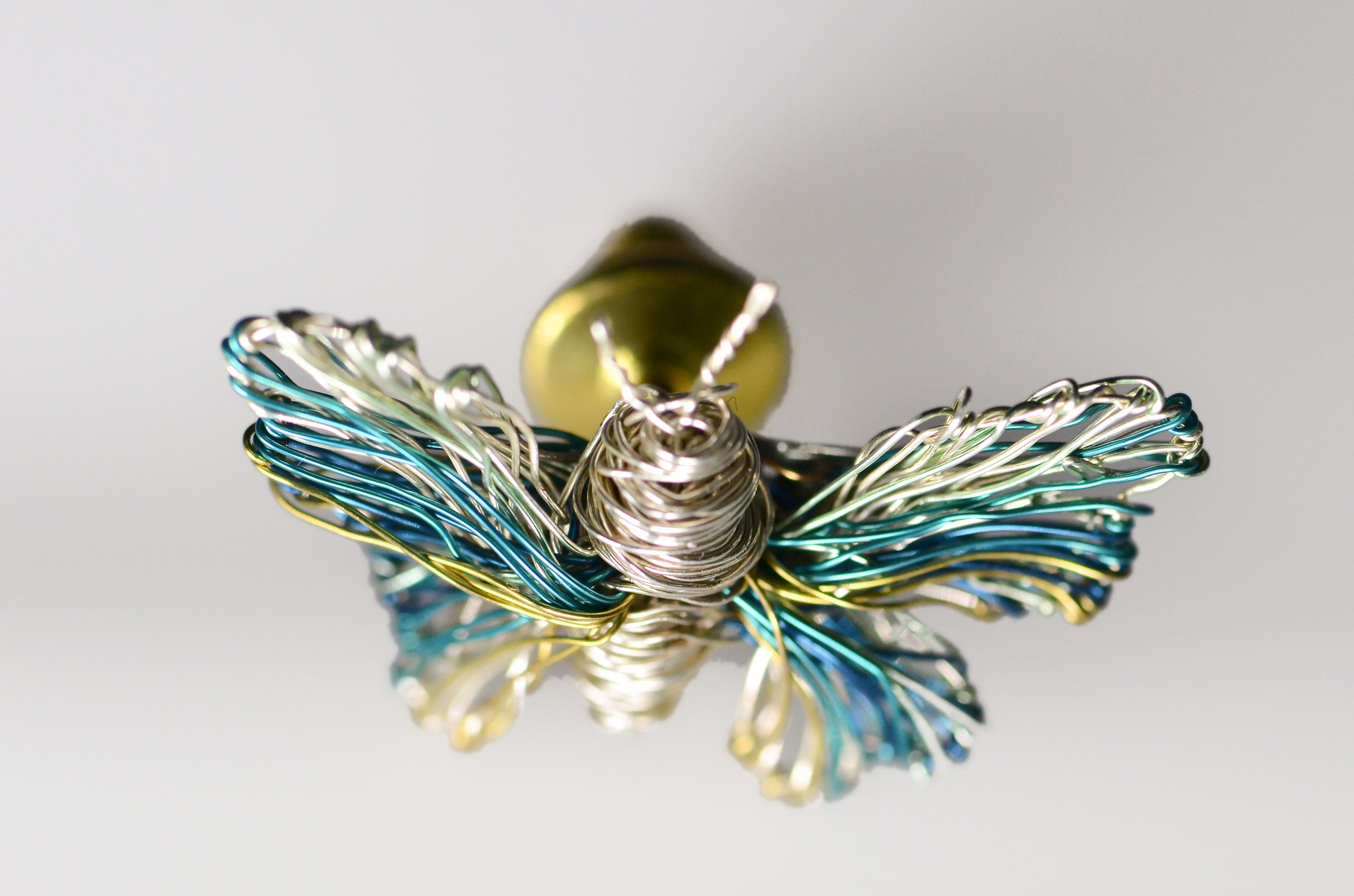 Silver Butterfly Pin · Negative Space Linework · Turquoise-navy Tones ...