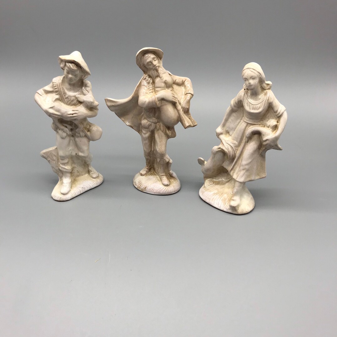 Trio of Pottery Figurines, Man Playing Pipes, Girl With Goose, Boy With ...