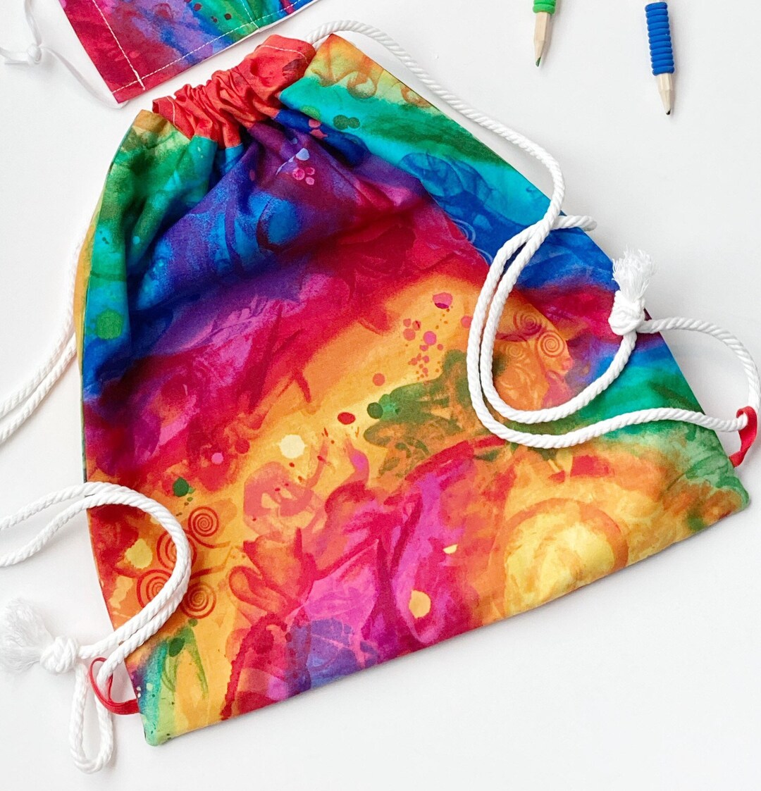 School book bag drawstring lined backpack in tie dyed bright rainbow ...