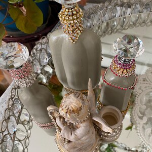 A Eclectic Vanity Set, 3 Unique Decorative Bottles and a Cherub Candle ...