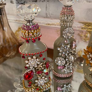 A Eclectic Vanity Set, 3 Unique Decorative Bottles and a a Crowned ...