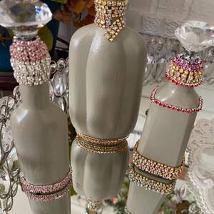 A Eclectic Vanity Set, 3 Unique Decorative Bottles and a Cherub Candle ...