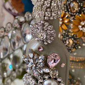 A Eclectic Vanity Set, 3 Unique Decorative Bottles and a Cherub Candle ...