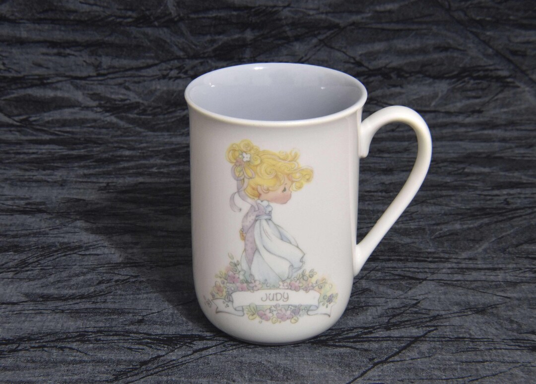 This is a “judy” Precious Moments Personalized Name Cup. Enesco ...