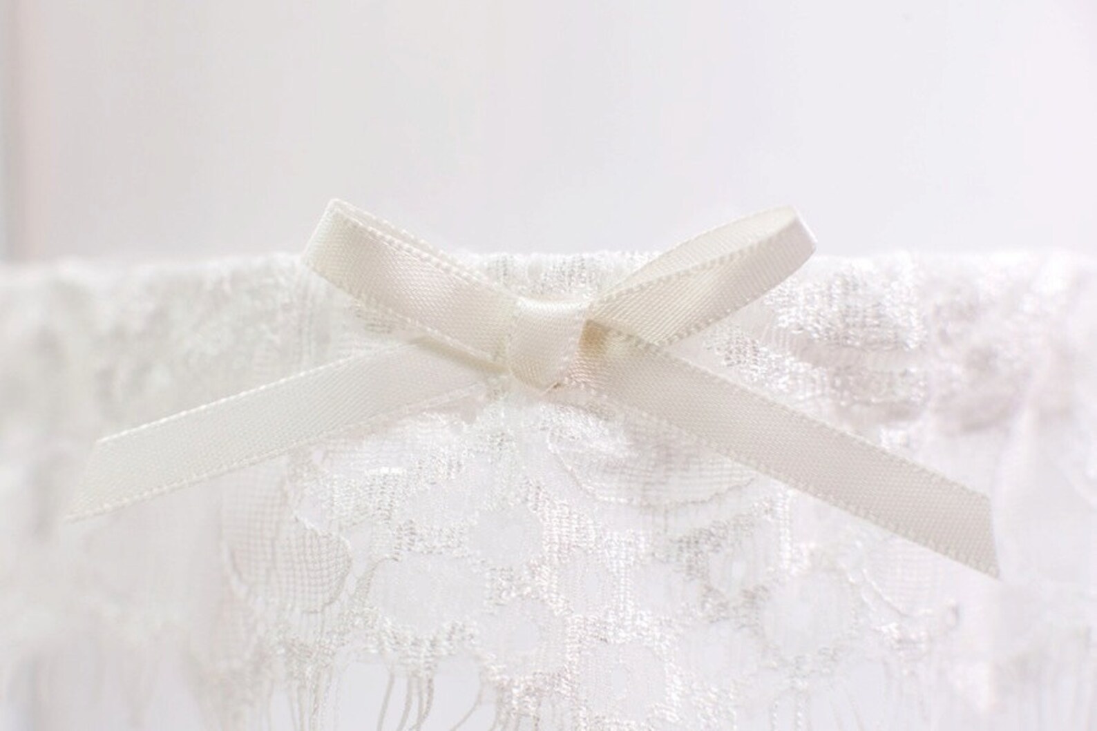 Delicate French Lace Toss Garter Delicate Lace Garter With Ivory Bow ...