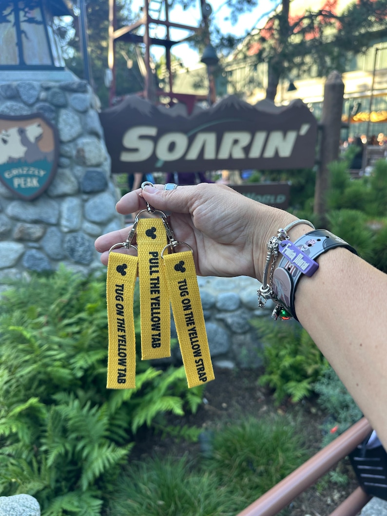 Pull the Yellow Tab Keychain | Theme Park Keychain | Yellow Strap ...