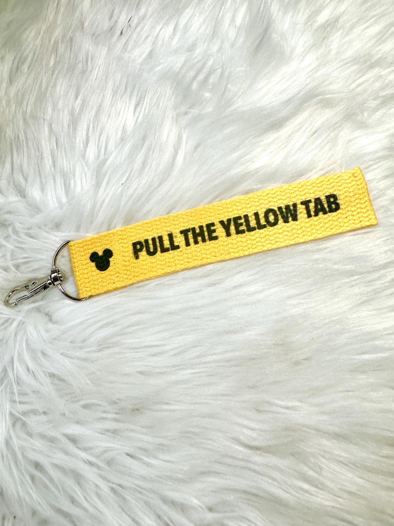 Pull the Yellow Tab Keychain | Theme Park Keychain | Yellow Strap ...