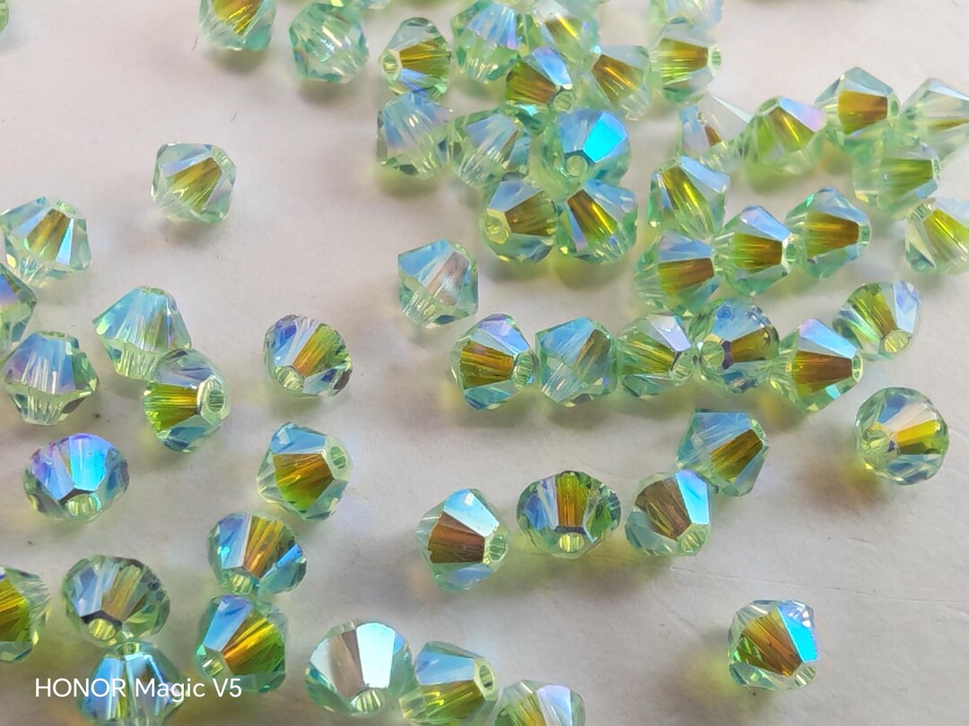 Swarovski Crystal 5328 4mm Xilion Bicone Beads - Chrysolite AB2X ...
