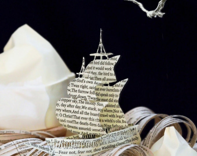 Justin Rowe paper sculptures and book art. by daysfalllikeleaves