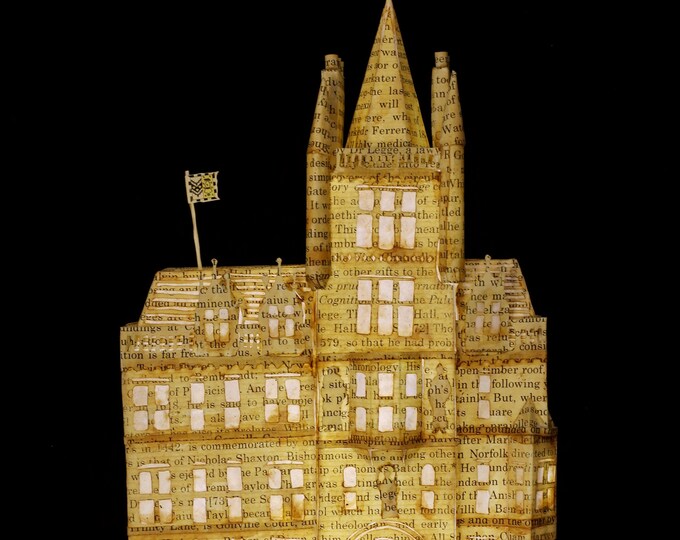 Justin Rowe paper sculptures and book art. by daysfalllikeleaves