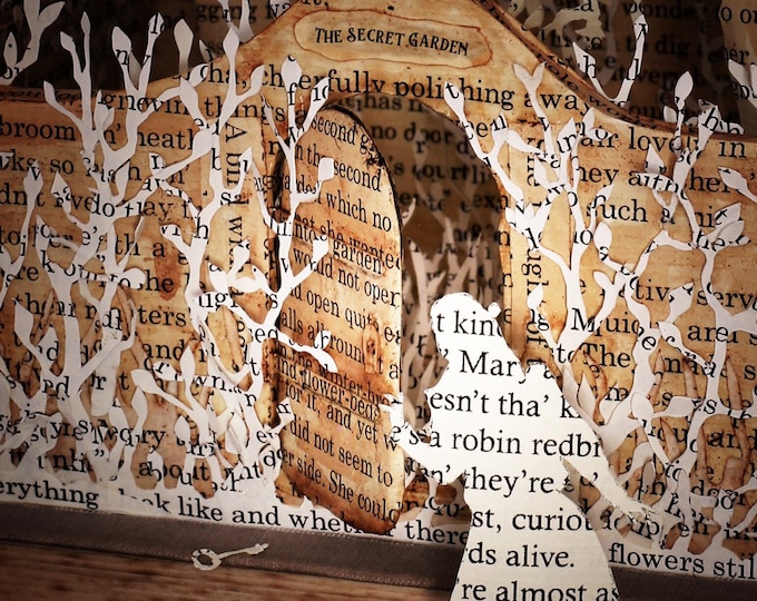 Justin Rowe paper sculptures and book art. by daysfalllikeleaves