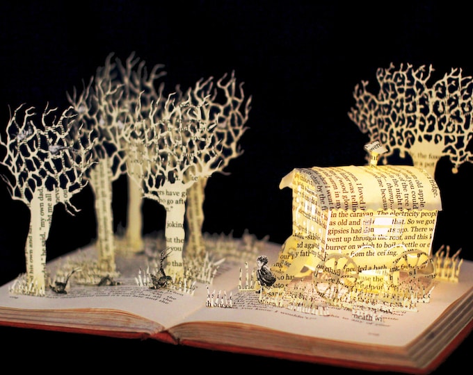 Justin Rowe paper sculptures and book art. by daysfalllikeleaves