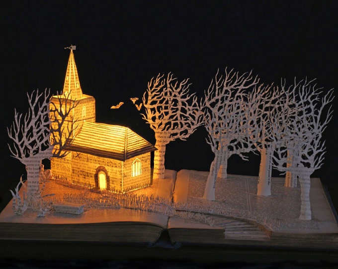 Justin Rowe paper sculptures and book art. by daysfalllikeleaves