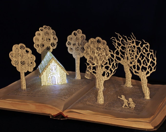 Justin Rowe paper sculptures and book art. by daysfalllikeleaves