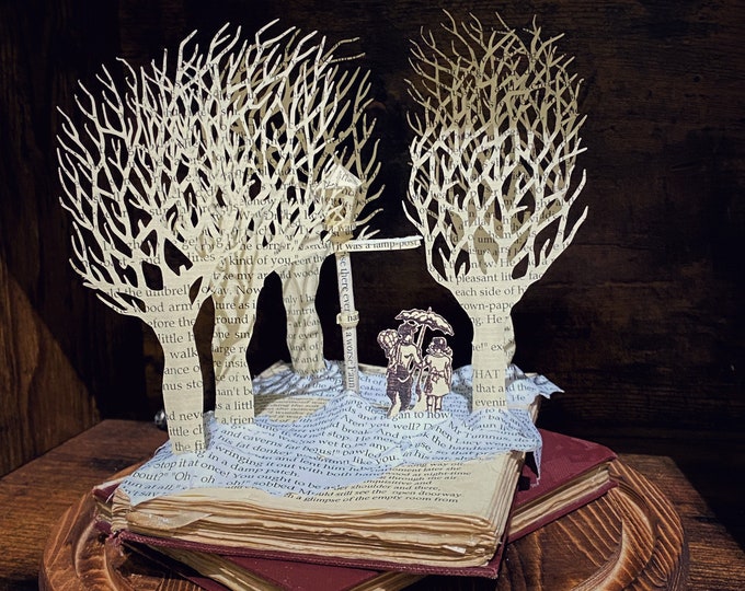 Justin Rowe paper sculptures and book art. by daysfalllikeleaves