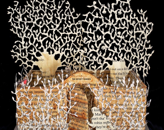 Justin Rowe paper sculptures and book art. by daysfalllikeleaves