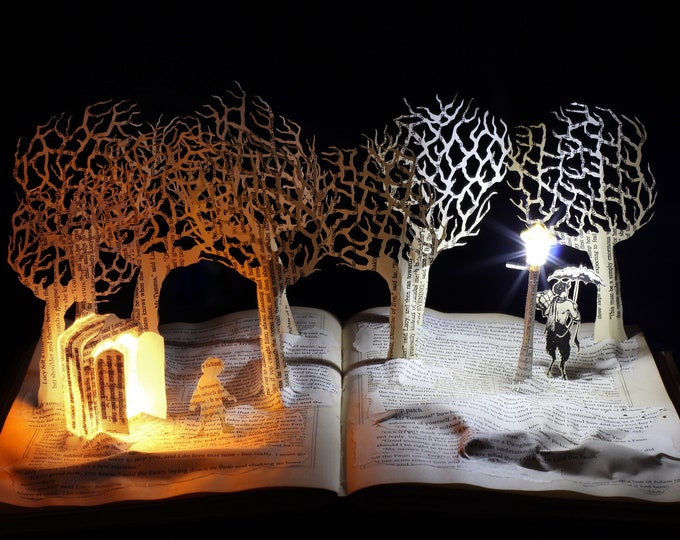 Justin Rowe paper sculptures and book art. by daysfalllikeleaves