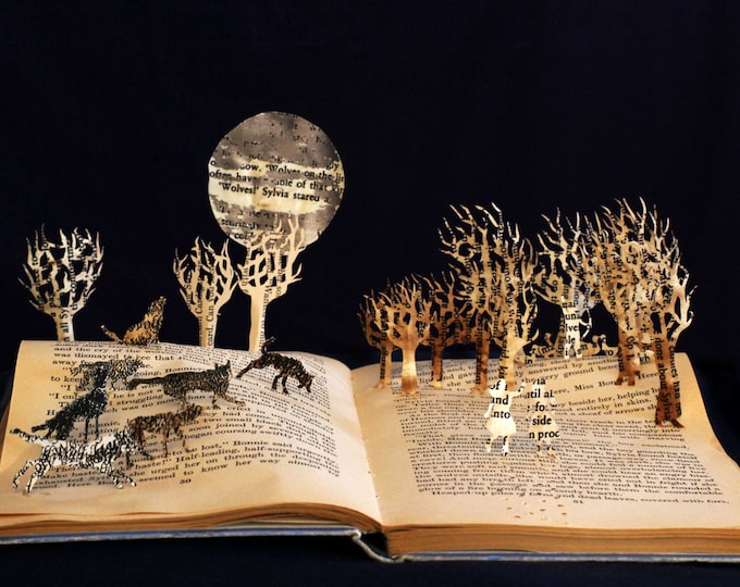 Justin Rowe paper sculptures and book art. by daysfalllikeleaves