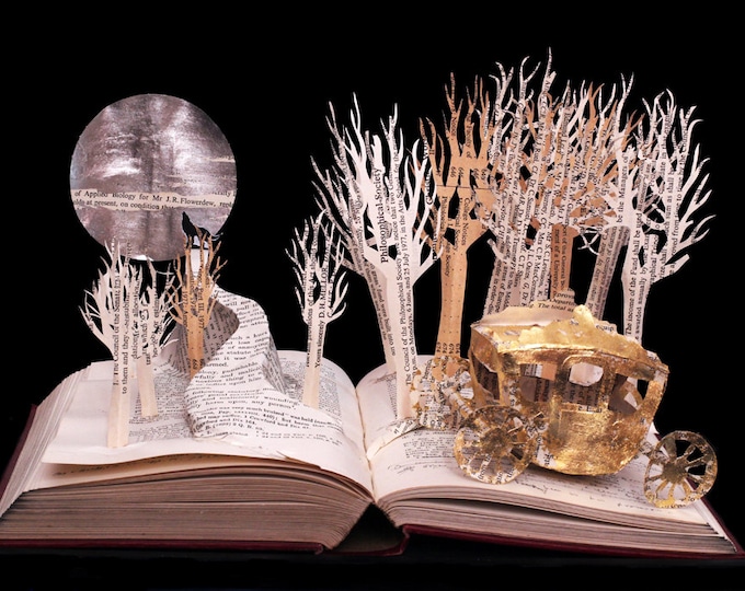 Justin Rowe paper sculptures and book art. by daysfalllikeleaves