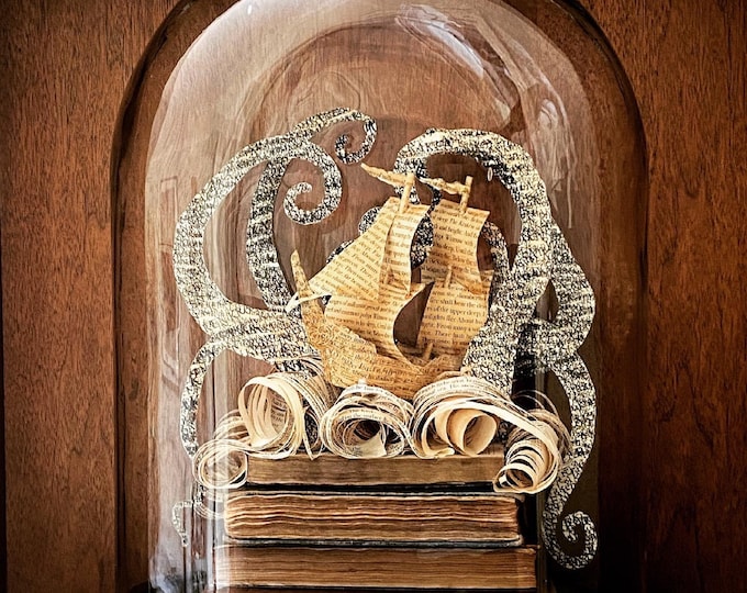 Justin Rowe paper sculptures and book art. by daysfalllikeleaves