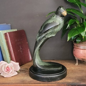 Metal Parrot Sculpture With Green Patina and Brass Colored Beak on Wood ...