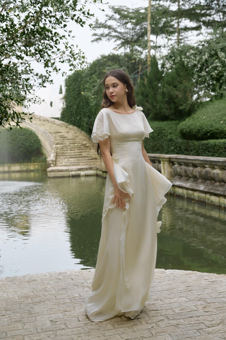 HANGKAO_ SELLY Dress, A Thigh Slit Design With Ruffled Panels, Adorned ...
