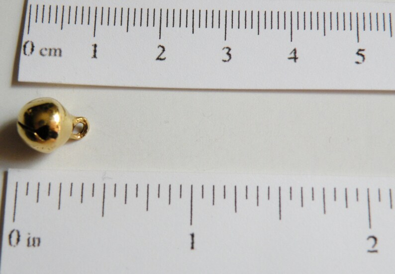 25 Gold Bells Christmas Jingle Bells round charms shiny gold | Etsy