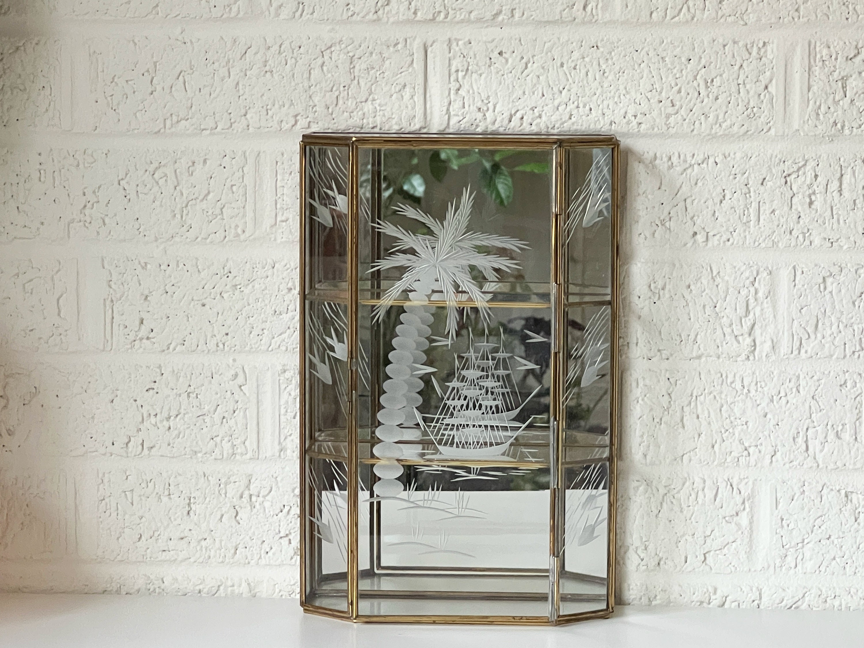 Brass and glass display case store