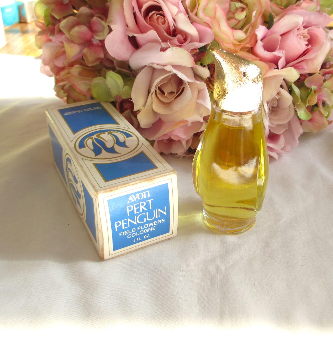 Avon Pert Penguin Decanter With Field of Flowers Cologne Adorable ...