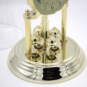 Vintage Anniversary Clock Glass Dome Brass Tone Spinning Weight Pendulum Analog Electric Quartz ...