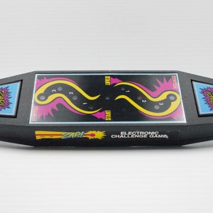 Vintage 1970s ZAP Electronic Challenge Game Handheld Game Red Green LED ...