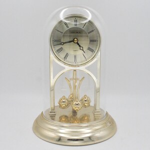 Vintage Anniversary Clock Glass Dome Brass Tone Spinning Weight Pendulum Analog Electric Quartz ...