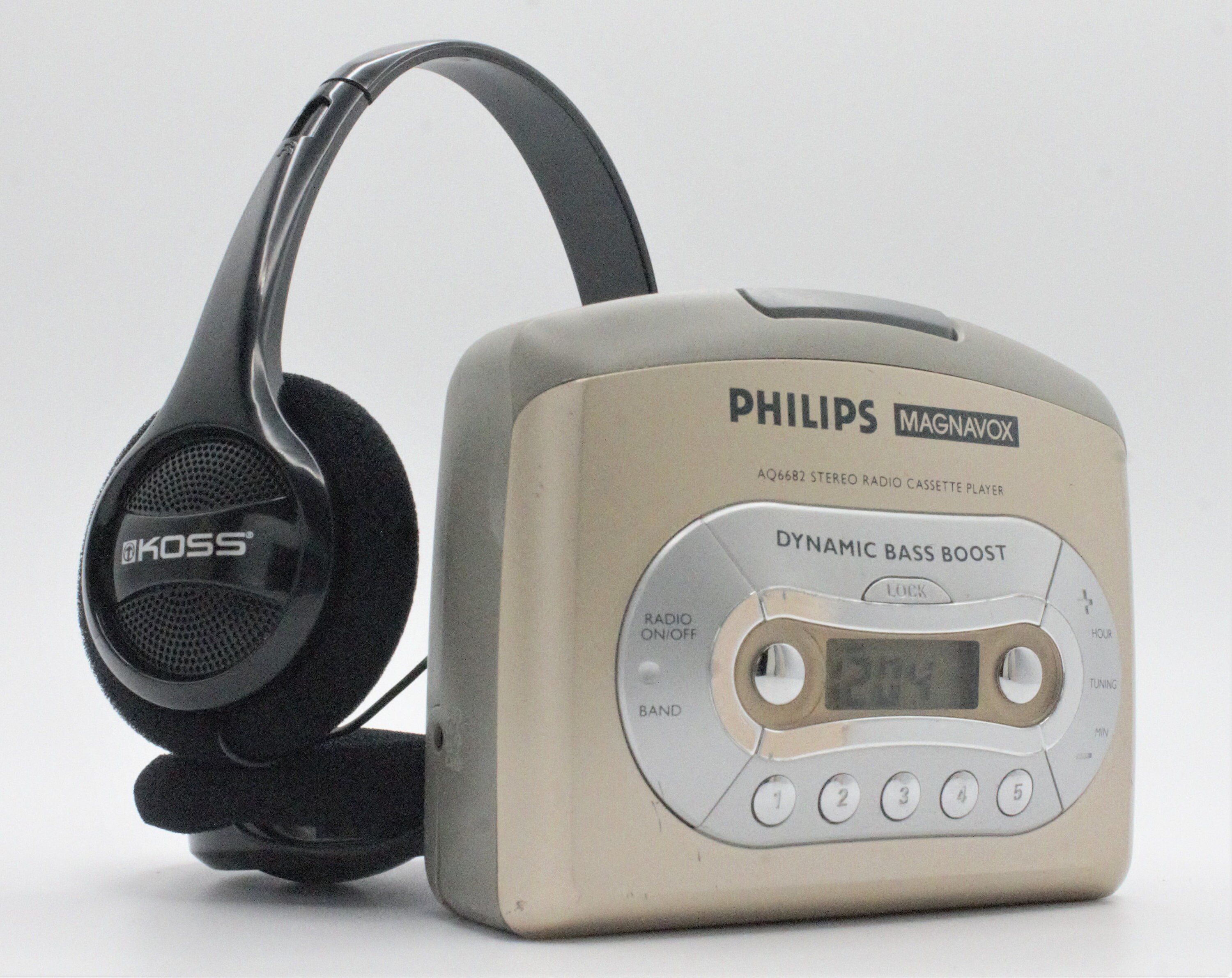 Vintage 90s personal stereo cassette player AM FM radio digital tuner LCD display screen bass boost clock headphones Pillips Magnavox