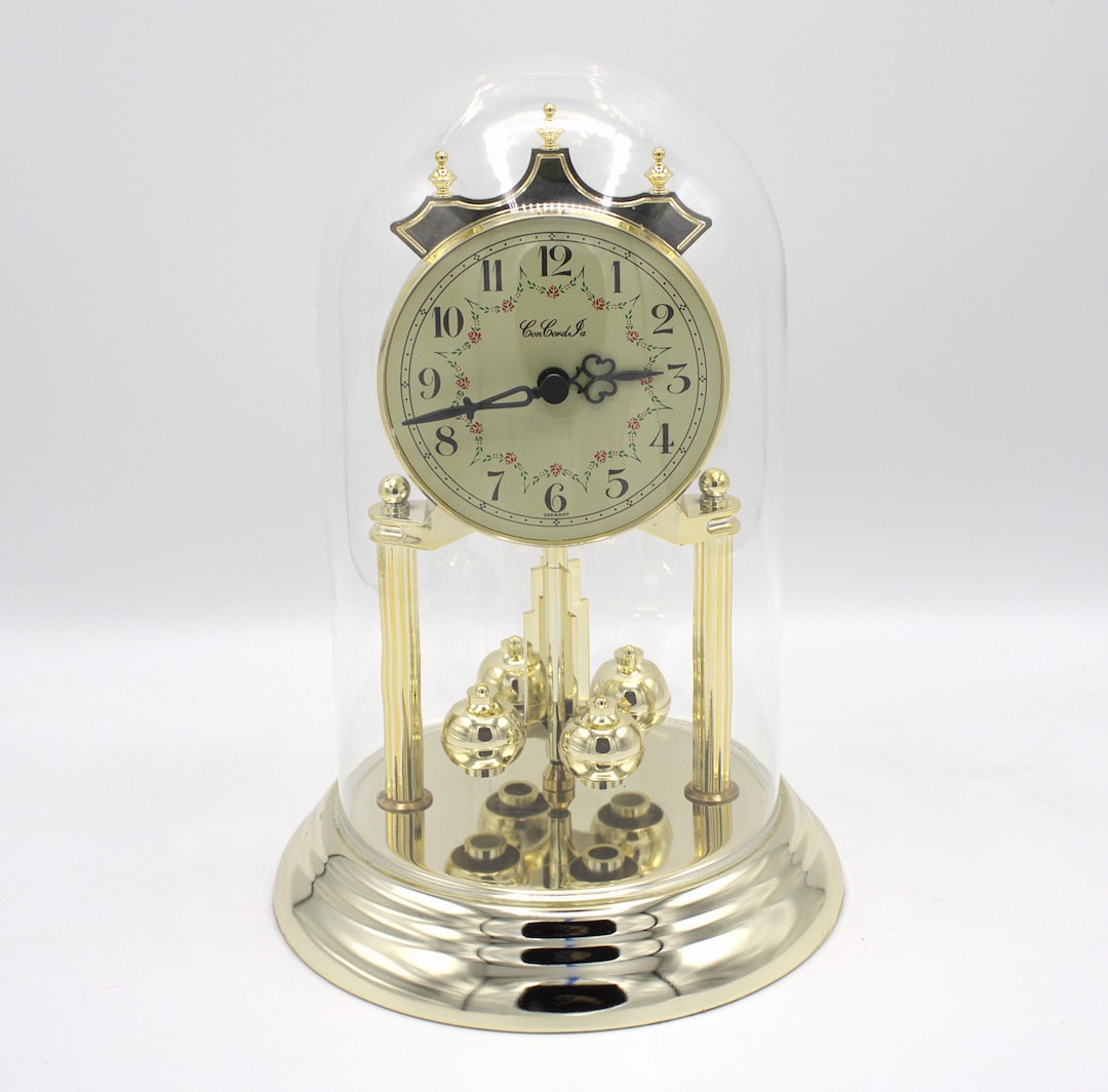 Vintage Anniversary Clock Glass Dome Brass Tone Spinning Weight Pendulum Analog Electric Quartz ...