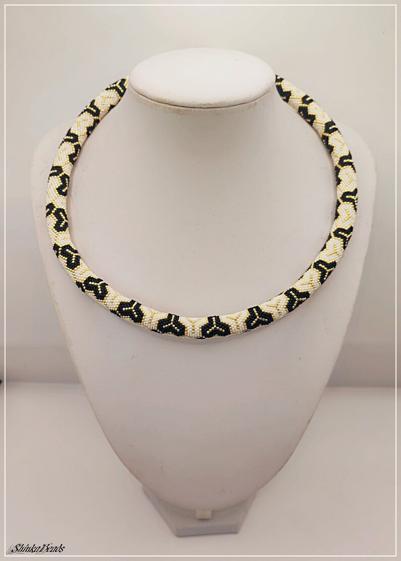 White, Black, and Golden Geometric Pattern Necklace, Ornamented Bead ...