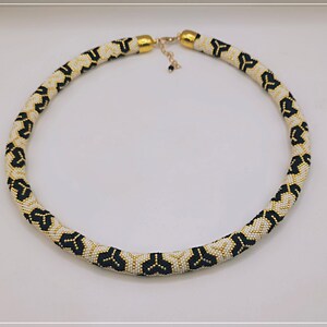White, Black, and Golden Geometric Pattern Necklace, Ornamented Bead ...
