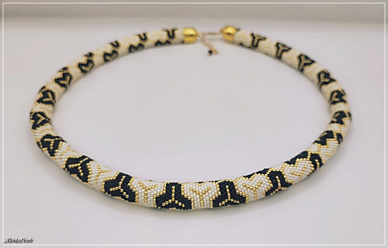 White, Black, and Golden Geometric Pattern Necklace, Ornamented Bead ...