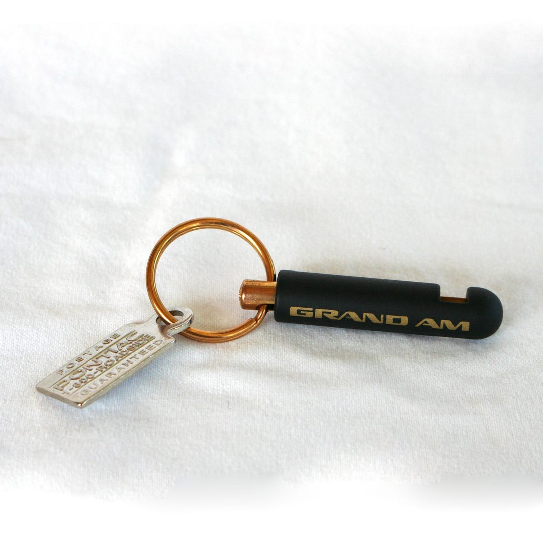 Vintage 1990s Pontiac Grand Am Key Chain Drop Tag, 1998, Black and Gold ...