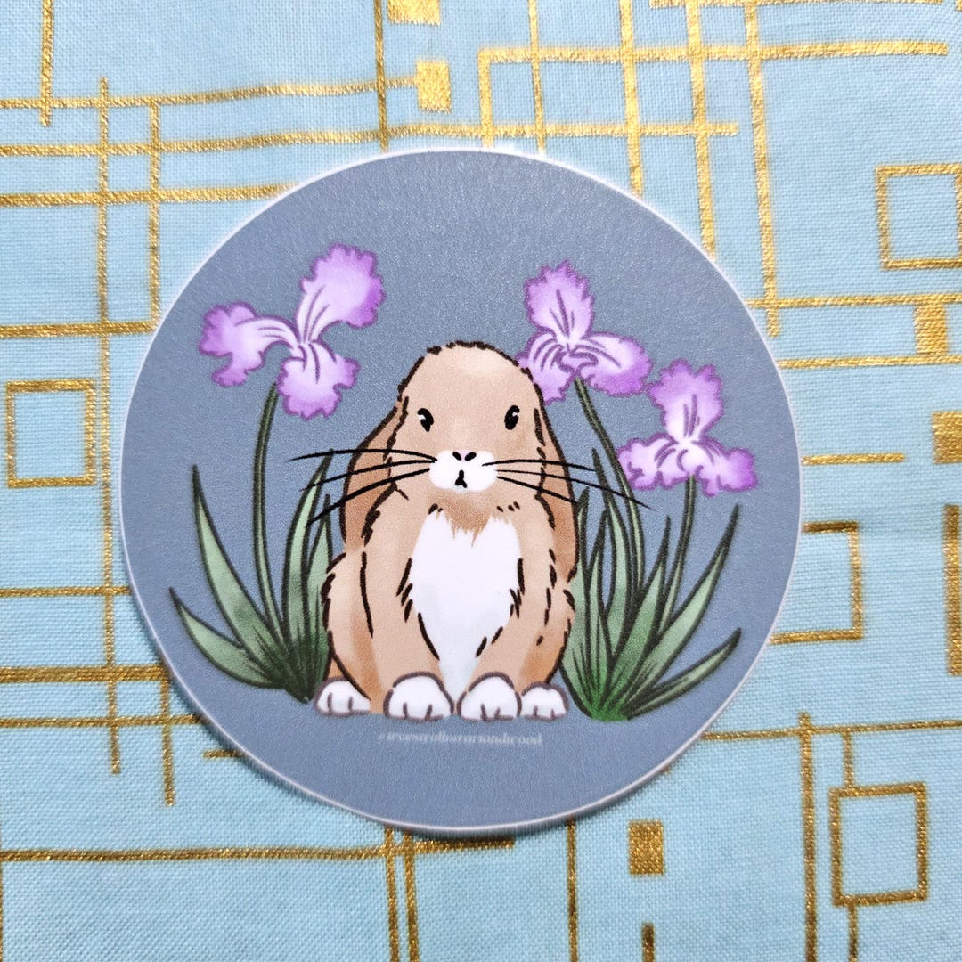 Cute Floppy Eared Bunny Sitting in a Bed of Purple Iris Flowers 2.5 ...