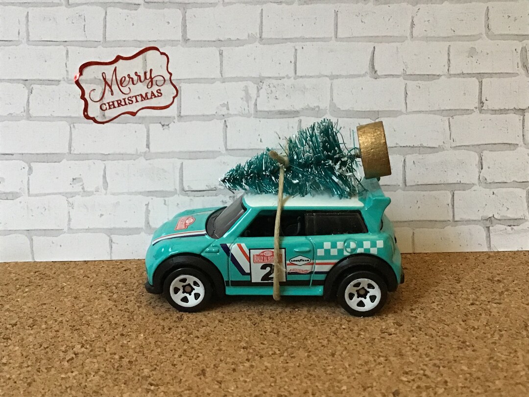 Mini Cooper Carrying Christmas Tree, Turquoise Mini Cooper Car ...