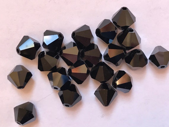Twelve beautiful discontinued Swarovski crystals Art. 5301 bicones 8mm jet hematite