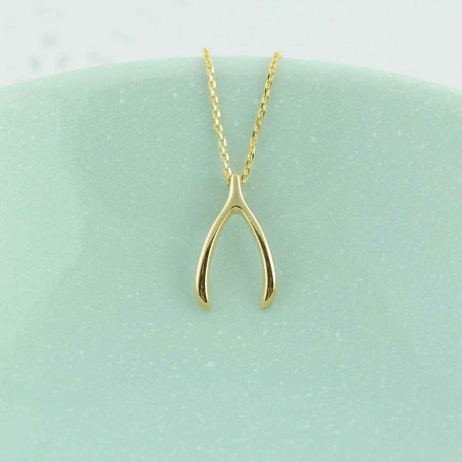 Gold Wish Bone Necklace. Wishbone Necklace in Gold. Jennifer Aniston ...