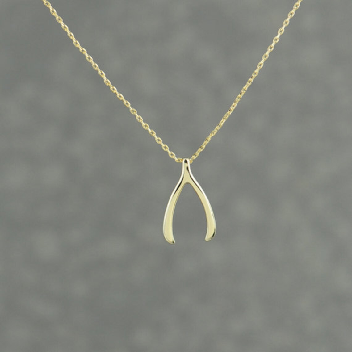 Gold Wish Bone Necklace. Wishbone Necklace in Gold. Jennifer Aniston ...