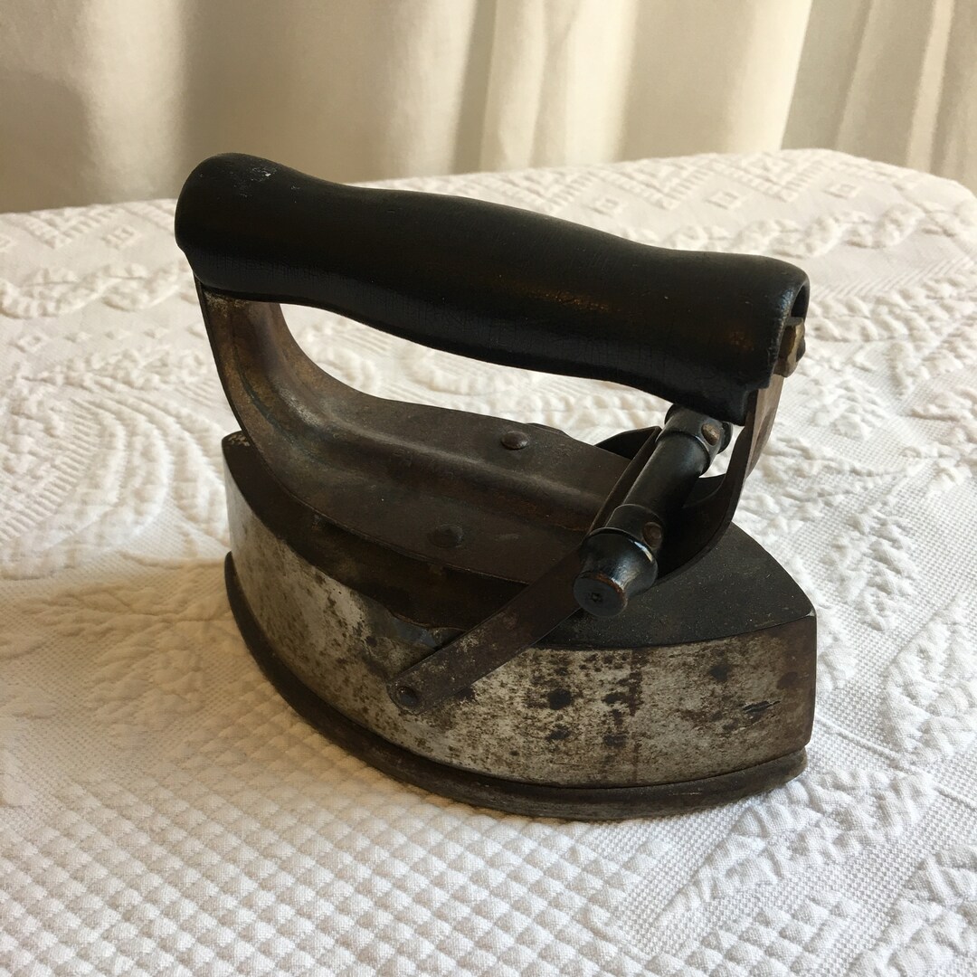 Antique Iron Heated on Cook Stove. USA Sad Iron Real Iron. Wooden ...