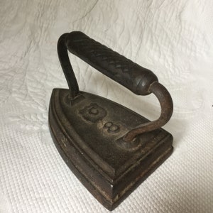 Antique Cast Iron No 8 Iron With Textured Handle and C Inside a Shield ...