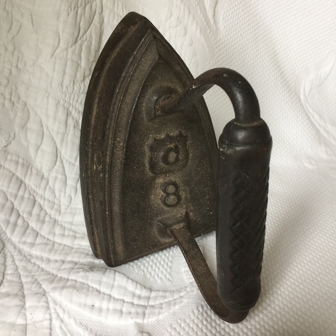 Antique Cast Iron No 8 Iron With Textured Handle and C Inside a Shield ...