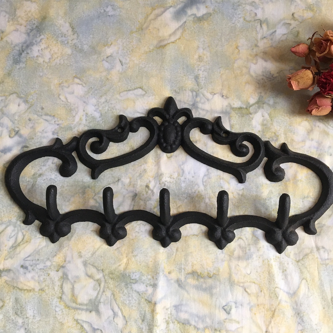 Vintage Cast Iron Wall Hooks With Swirling Designs and a Small Pineapple Shape in the Top Center ...