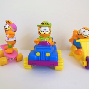 Mcdonalds Garfield Happy Meal Toys, 3 Vehicles, Pink Skateboard, Blue 4 ...