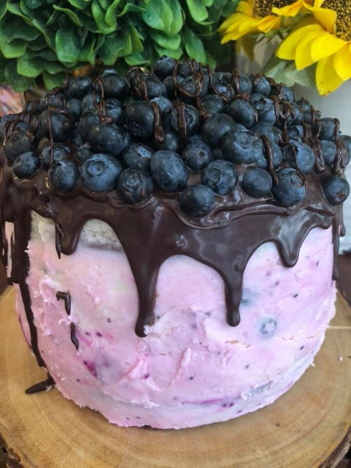Vegan double vanilla blueberry chocolate cake with fresh blueberries on ...